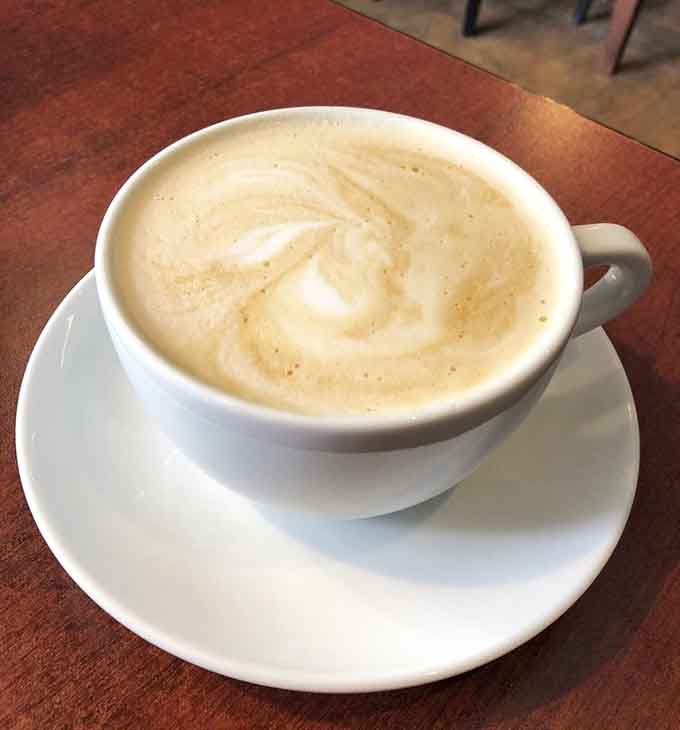 That perfectly swirled latte art isn't just for show, it signals the serious coffee program happening behind the counter.