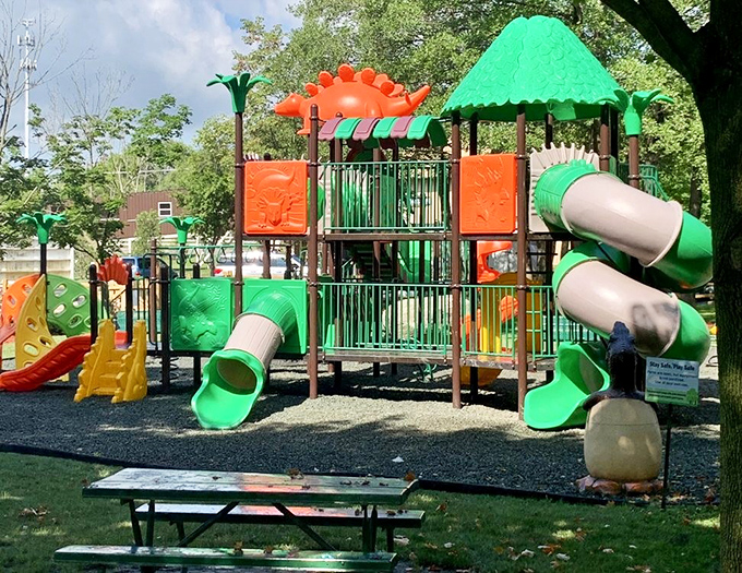 The outdoor playground combines prehistoric themes with modern fun, perfect for burning off energy between exhibits.