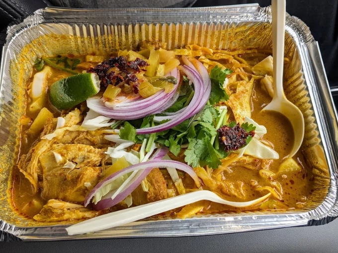 Northern Thailand's gift to Vermont, egg noodles swimming in curry broth topped with crispy noodles create textural paradise in a bowl.