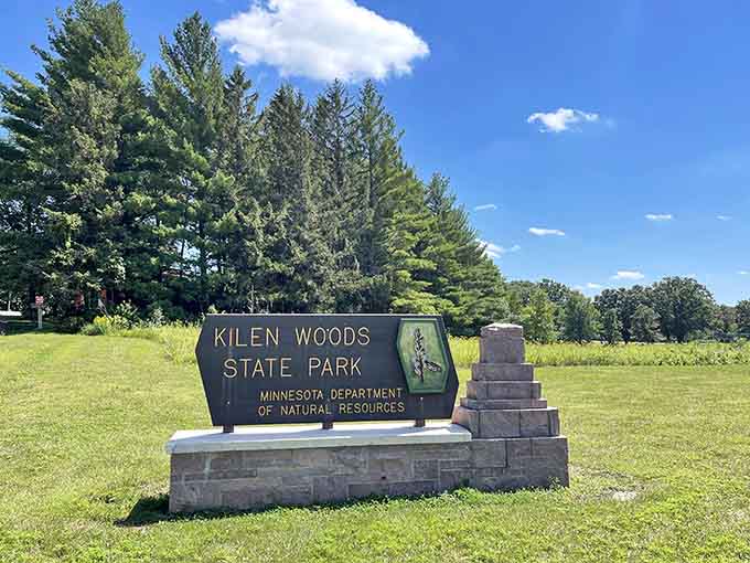 That state park sign stands there like a promise that what's beyond it is worth leaving your phone in the car.