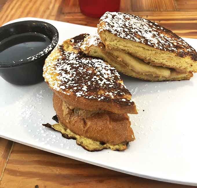 King's French Toast &ndash; golden-brown perfection dusted with powdered sugar, ready for a drizzle of maple syrup. Breakfast or dessert? Both!