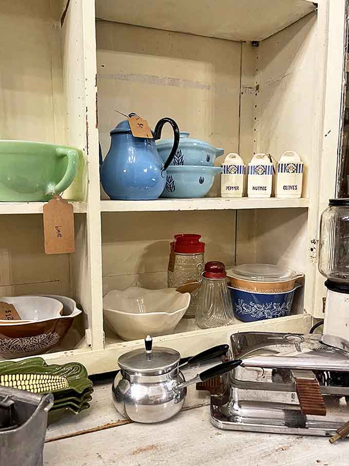 Grandma's kitchen, perfectly preserved. That blue teapot has poured comfort for decades, one cup at a time.
