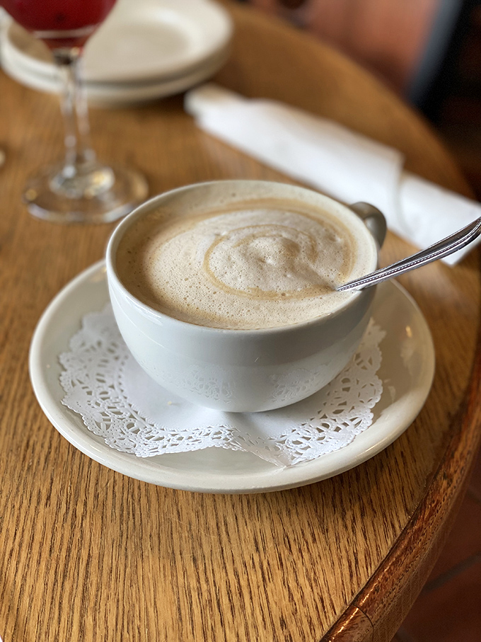 Coffee as art form &ndash; a velvety latte served on a doily that says, "This isn't just caffeine, it's an experience."