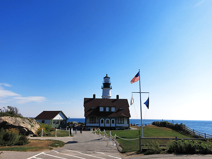 The welcoming path to the lighthouse invites exploration, with every step bringing you closer to one of America's most beloved maritime treasures.