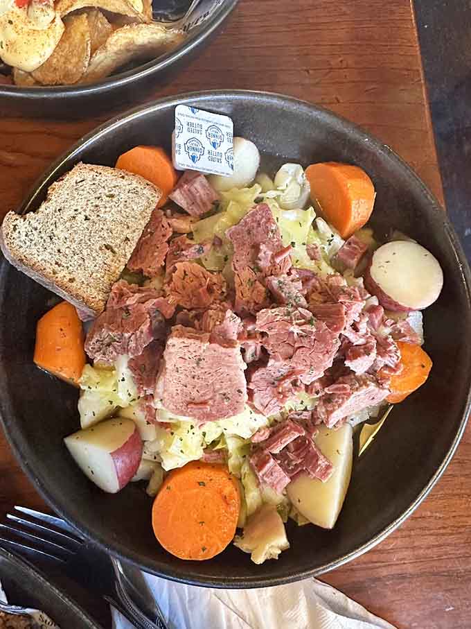 That generous pile of corned beef with vegetables and brown bread is traditional Irish cooking at its finest, hearty and honest.