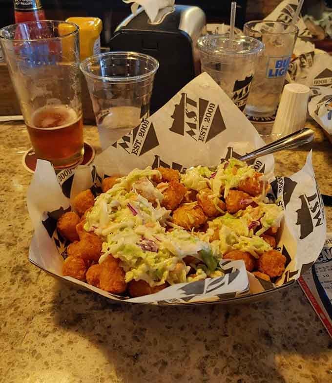 Tater tots loaded with toppings become a meal unto themselves, proving size doesn't always matter when flavor's involved.