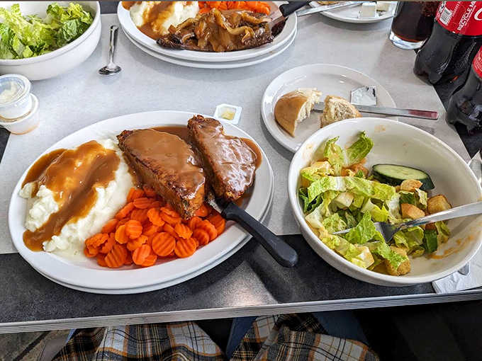 Comfort food royalty on a throne of mashed potatoes, this gravy-draped meatloaf makes Monday feel like a warm hug.