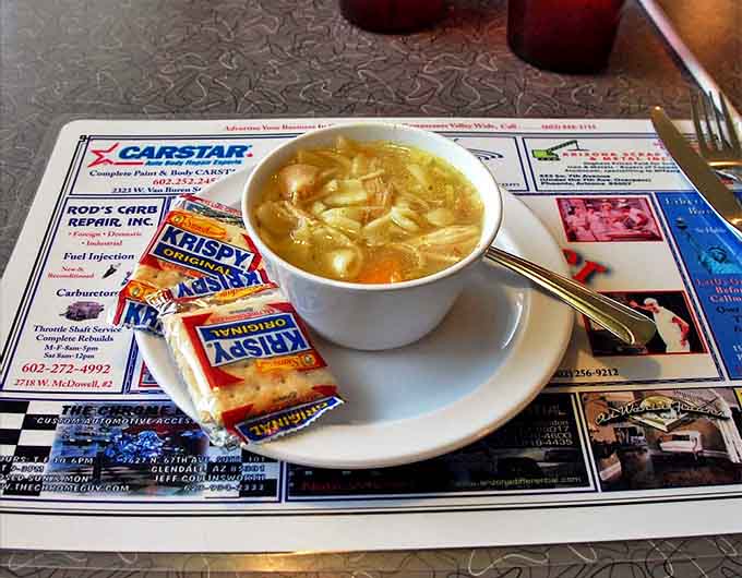 Homemade chicken noodle soup that looks like someone's grandmother made it, because that's exactly the level of care involved here.