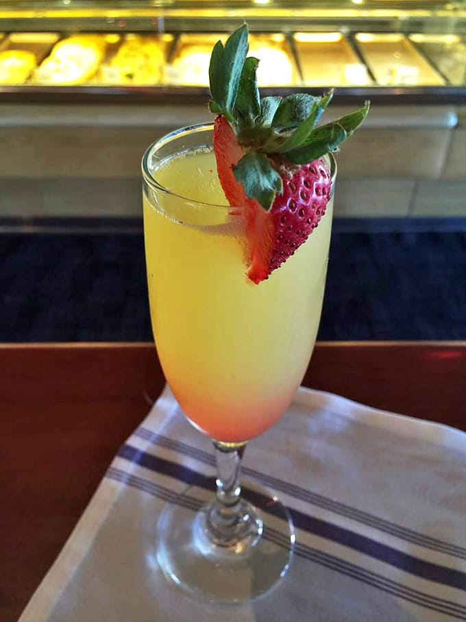 Weekend brunch isn't complete without this mimosa &ndash; sunshine in a glass, garnished with a strawberry that's practically showing off.