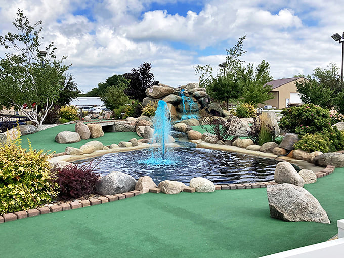 Casey's miniature golf course elevates the putt-putt experience with beautiful water features, natural stone borders, and lush plantings that create a garden-like setting for friendly competition.
