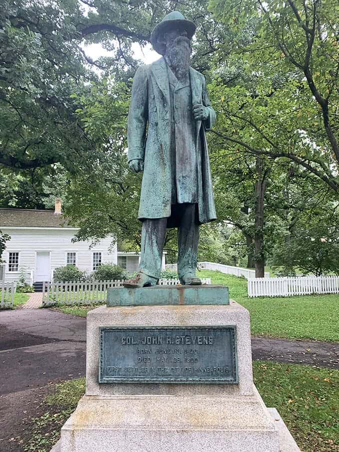 Colonel John H. Stevens stands watch over the park, forever commemorated as Minneapolis's first permanent settler who built that historic house nearby.