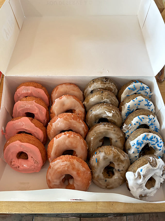 A box of assorted treats showcasing the rainbow of possibilities &ndash; from classic glazed to adventurous flavor combinations, each one promising its own unique sugar rush.