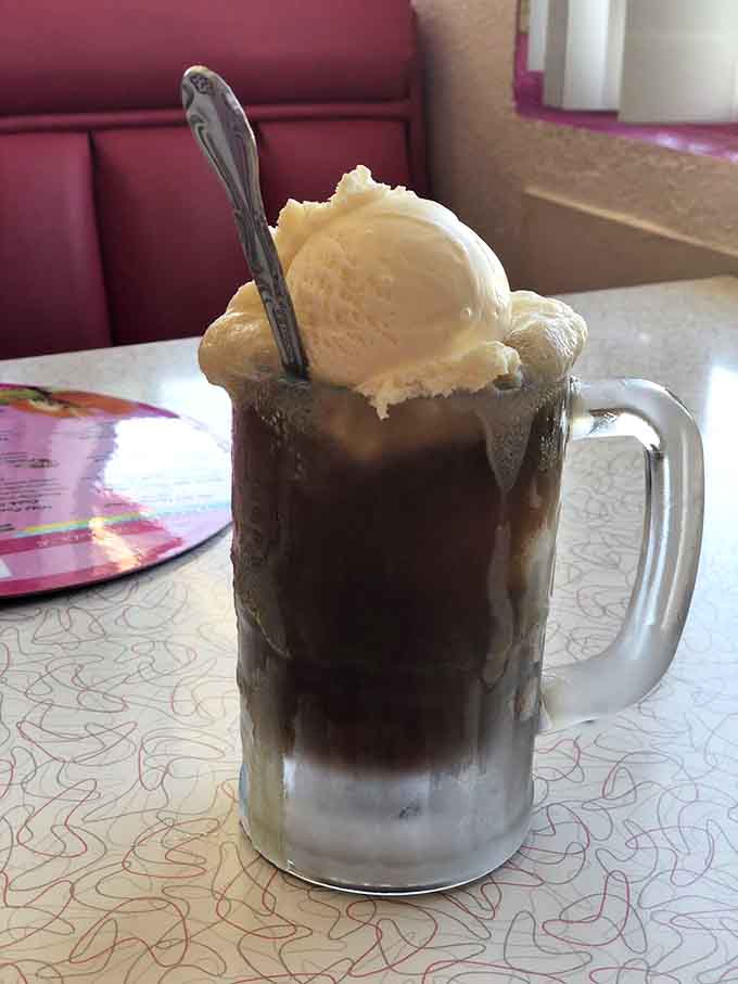 The root beer float towers majestically in its frosty mug, fizzing with pure nostalgic joy and vanilla dreams.