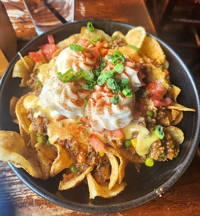 Irish nachos reinvent the classic appetizer with house-made potato chips, shepherd's pie filling, and beer cheese – a cross-cultural masterpiece that makes perfect sense.