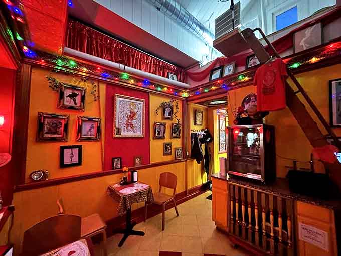 Vintage-style tables with glass tops display more memorabilia, turning the simple act of waiting for your food into an engaging museum experience.