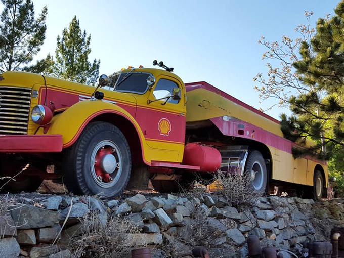 This vibrant yellow and red Shell truck pops against the desert landscape &ndash; a colorful ambassador from transportation's golden age.