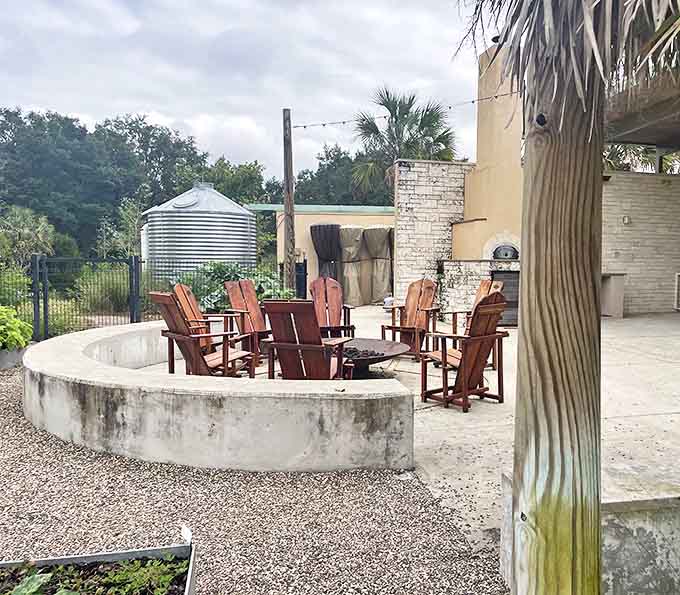 Adirondack chairs circle a fire pit, inviting visitors to pause and contemplate – the garden's version of a Florida living room.