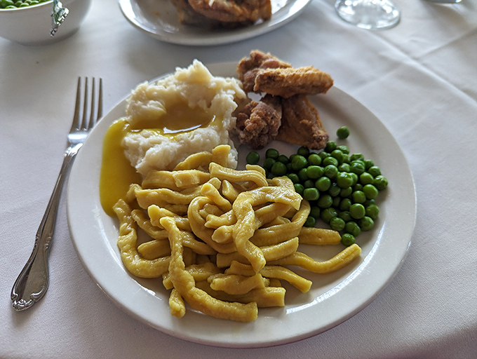 Homemade noodles swimming in golden gravy alongside perfectly cooked vegetables. Sides that refuse to be overshadowed by the famous chicken.