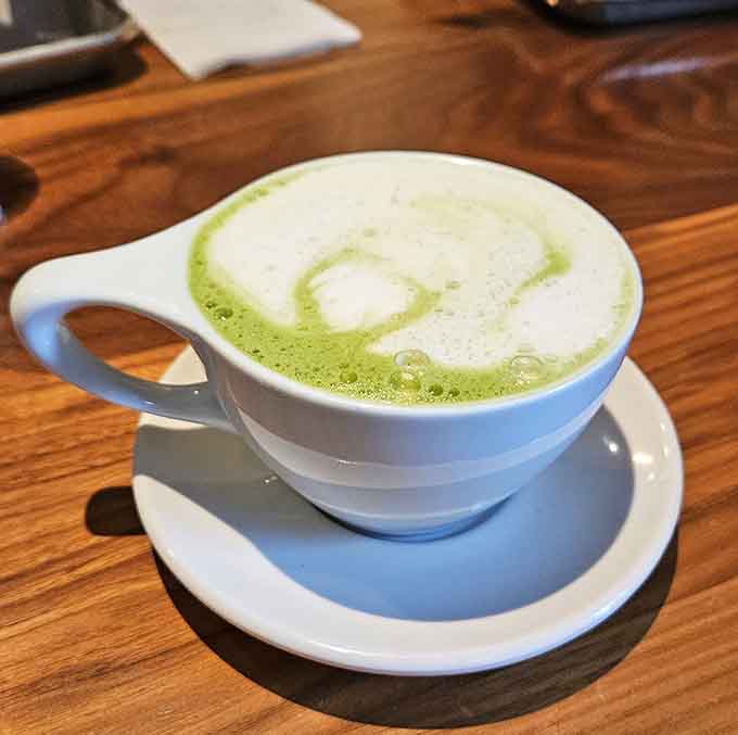 That vibrant matcha latte brings a pop of green zen to your morning, because sometimes coffee needs a colorful cousin.