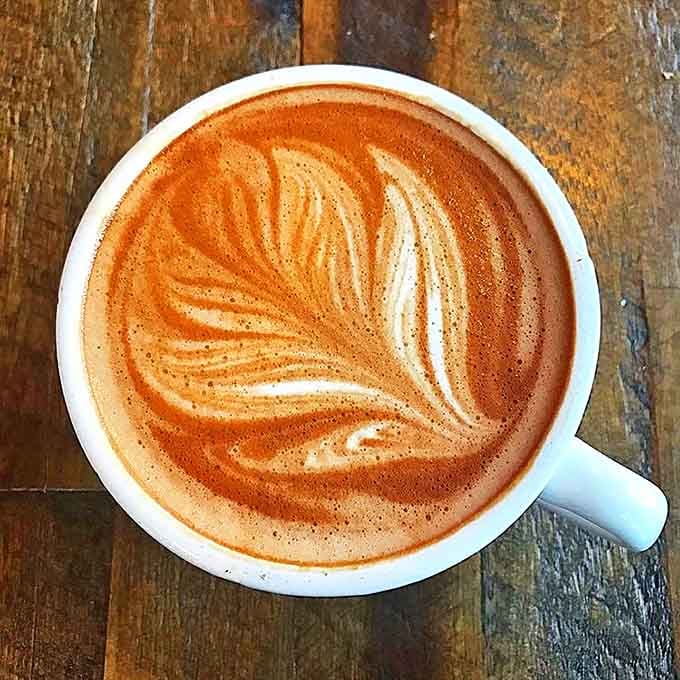 Coffee art worthy of a gallery exhibition&mdash;this latte's leaf design floats atop velvety microfoam and robust espresso.