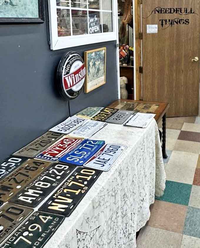 Vintage license plates tell stories of Michigan roads traveled, each one a small piece of automotive history waiting for display.
