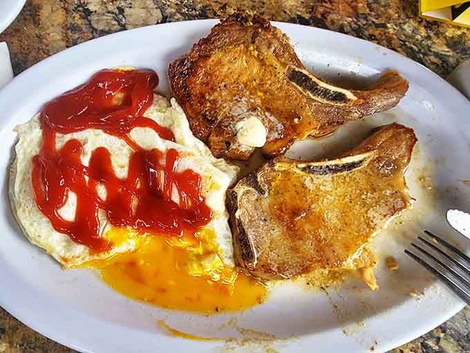 Perfectly grilled porkchops with eggs sunny-side up, the breakfast of champions at any hour.