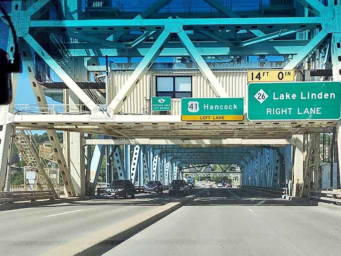 Driving through the Portage Lake Lift Bridge feels like passing through a portal, with directional signs pointing to adventures on either shore.