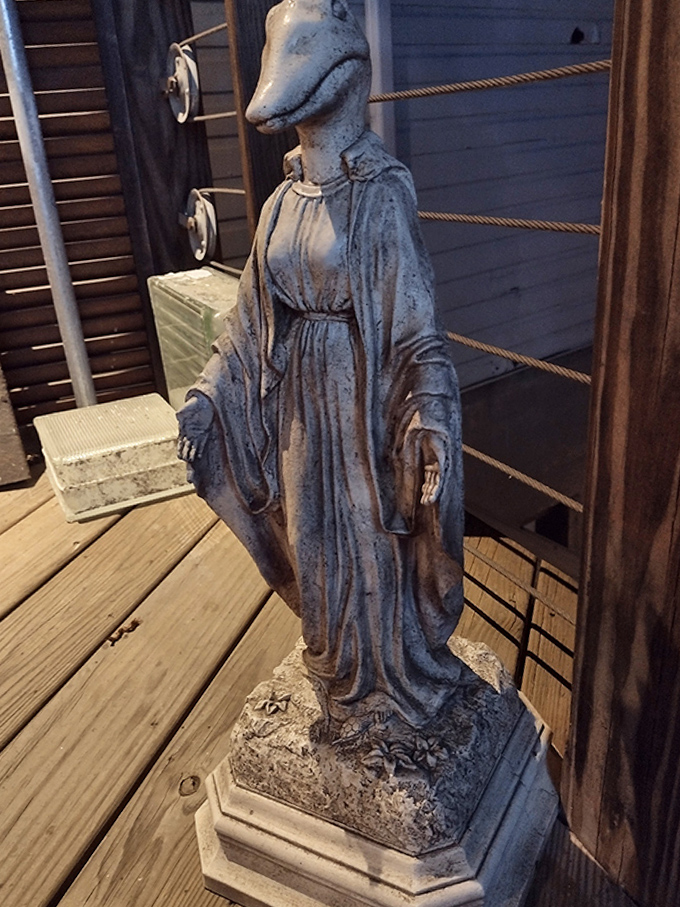 A duck-headed statue stands sentinel among the curiosities, challenging visitors to question what constitutes "normal" in a museum setting.