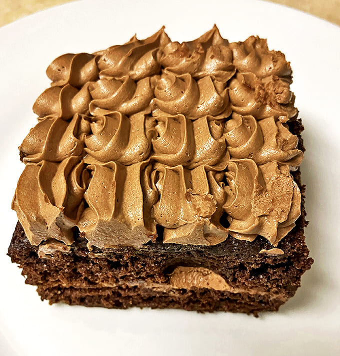 Chocolate on chocolate on chocolate &ndash; this cake doesn't just satisfy cravings, it silences them into blissful submission.