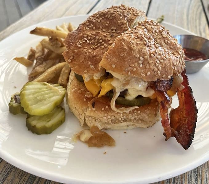 Even the burgers here understand the assignment, stacked high with quality ingredients that show the kitchen's commitment extends beyond seafood alone.