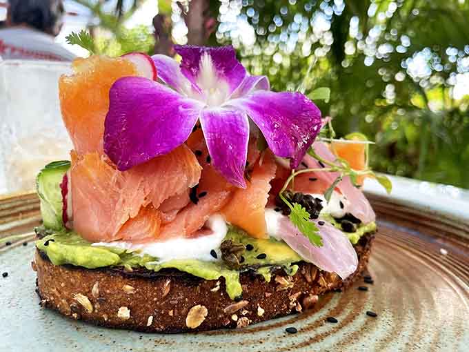 Salmon avocado toast elevated with edible flowers and perfect poaching &ndash; proof that sometimes the simplest combinations create the most memorable flavors.