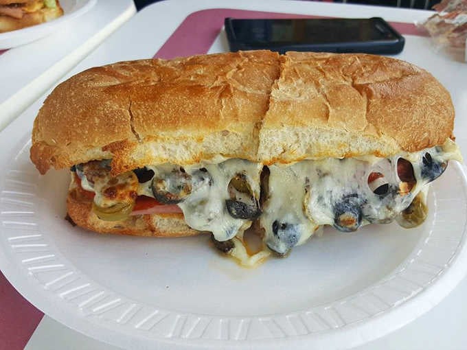 The Sami sub showcases Stewie's talent for balanced flavor combinations. That perfect cross-section reveals the architectural precision behind every sandwich.