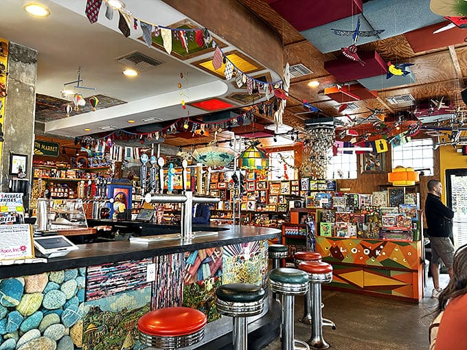 The bar area looks like it was designed by someone who believes that practical spaces can still be playful&mdash;note the colorful stools and whimsical details.