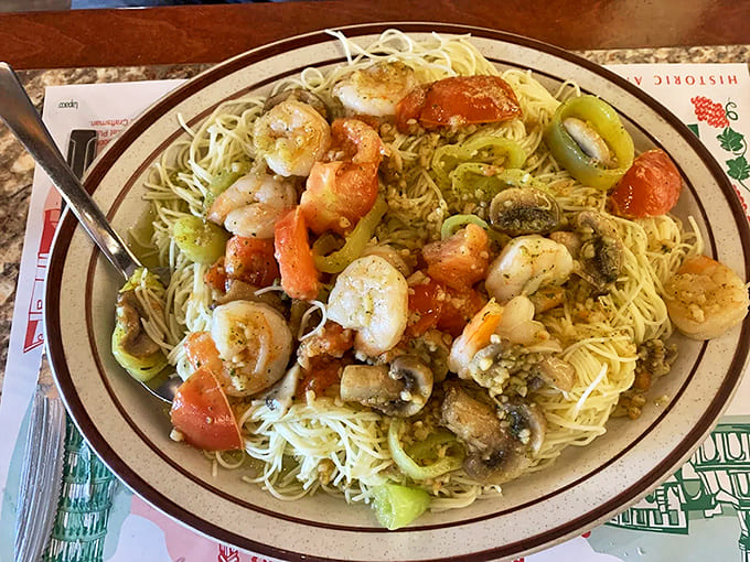 Plump shrimp bathe in garlicky butter sauce atop angel hair pasta that's absorbed all the right flavors.