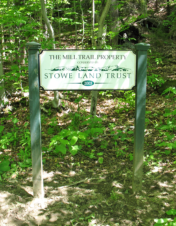 The Mill Trail Property sign stands as a quiet reminder of conservation efforts preserving this natural wonder for future generations.