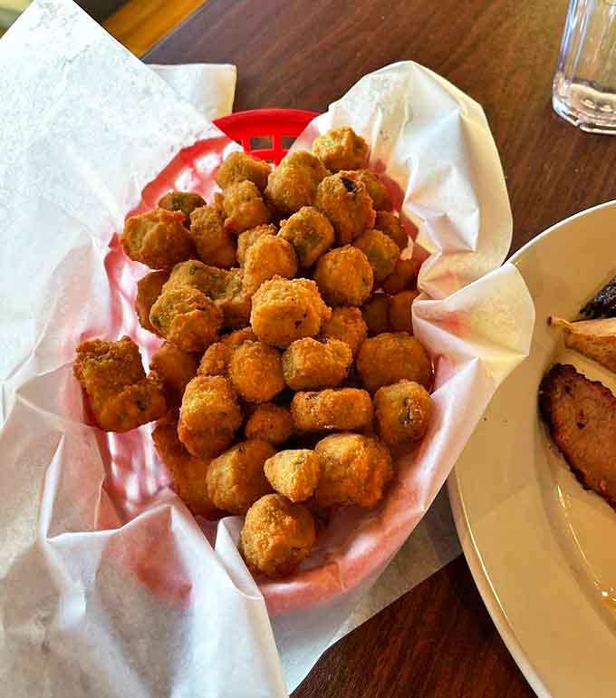 Golden nuggets of fried okra that convert skeptics daily. Even okra-doubters become believers after one crispy, non-slimy bite.