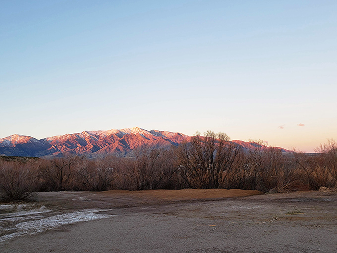 Sunset paints the mountain peaks with impossible pinks and purples, a daily masterpiece that no smartphone camera can truly capture.