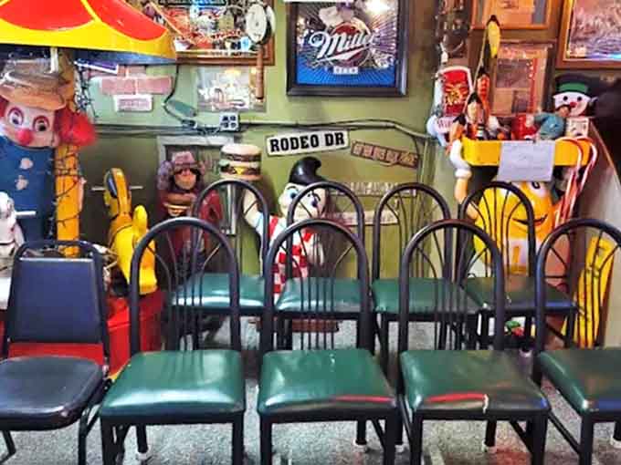 Green vinyl chairs await patrons in one of the dining areas, surrounded by enough memorabilia to stock a small museum.