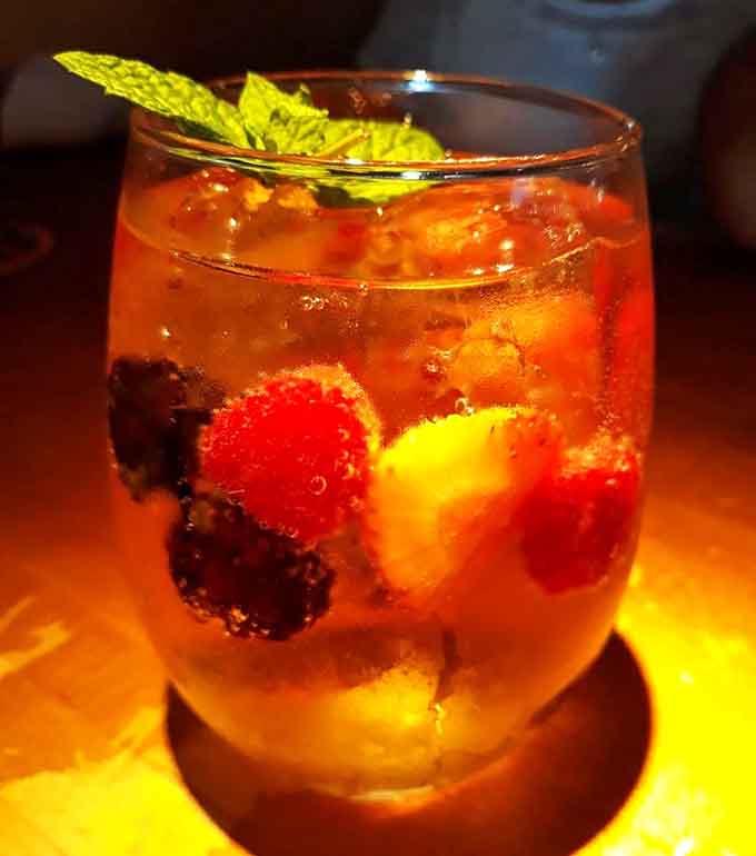 Fresh fruit sangria in a generous glass pairs surprisingly well with hearty pub fare and good conversation.