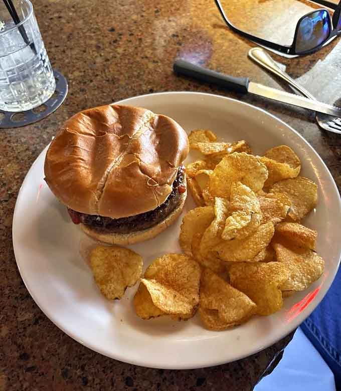 A burger and chips combo that looks simple but delivers on every crispy, juicy promise it makes.
