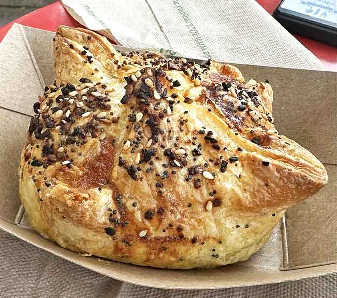 A pastry so perfectly puffed and seeded, it looks like it graduated with honors from the University of Deliciousness. Paul Hollywood would approve.