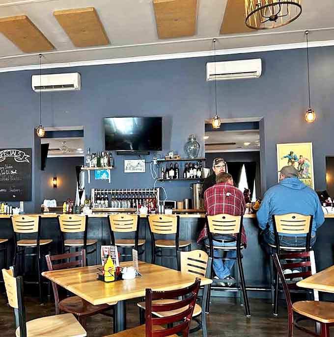 The bar area buzzes with friendly conversation as locals settle in for their favorite meals, creating the community atmosphere that makes this place special.