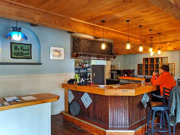 The bar area offers a cozy spot to enjoy your morning coffee or evening beverage, with that perfect neighborhood restaurant vibe that makes everyone feel welcome.