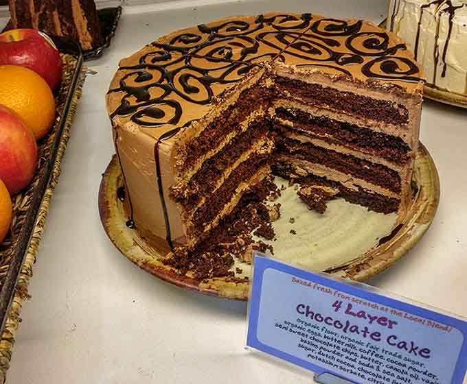 Multiple layers of chocolate cake with caramel frosting and decorative swirls make birthdays and Tuesdays equally worth celebrating here.