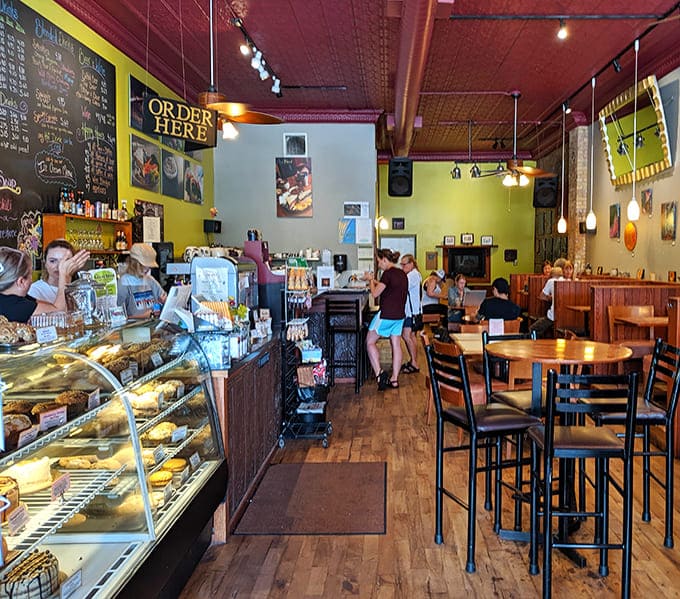 Bright yellow walls and local art create an energetic backdrop for the serious business of enjoying exceptional coffee and even better baked goods.
