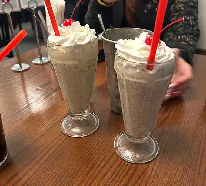 These towering milkshakes crowned with whipped cream and cherries are thick enough to require commitment and delicious enough to earn it.