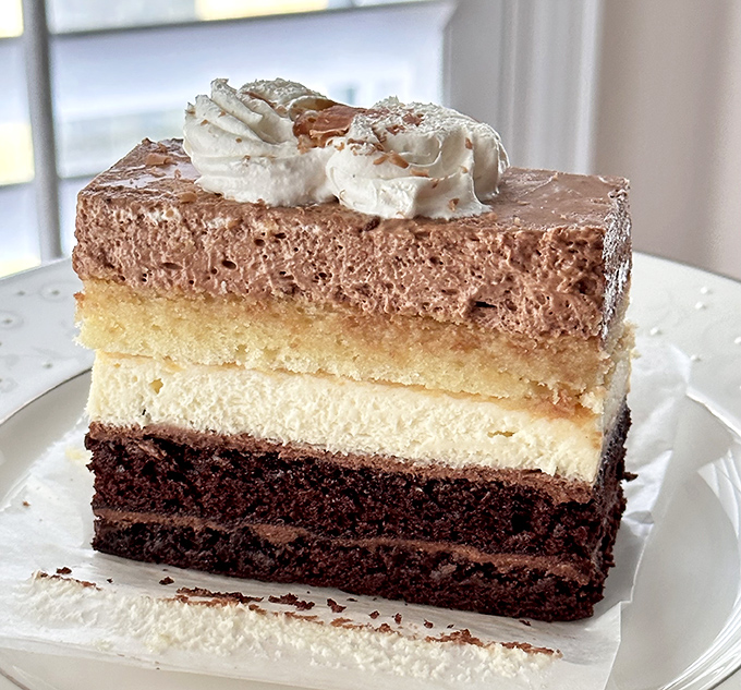 Layers of chocolate, sponge, and cream create a tiramisu that balances rich indulgence with airy lightness.