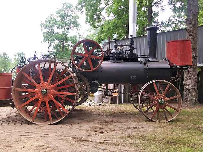 This magnificent steam traction engine represents the technological revolution that transformed American farming, its massive wheels dwarfing modern machinery.