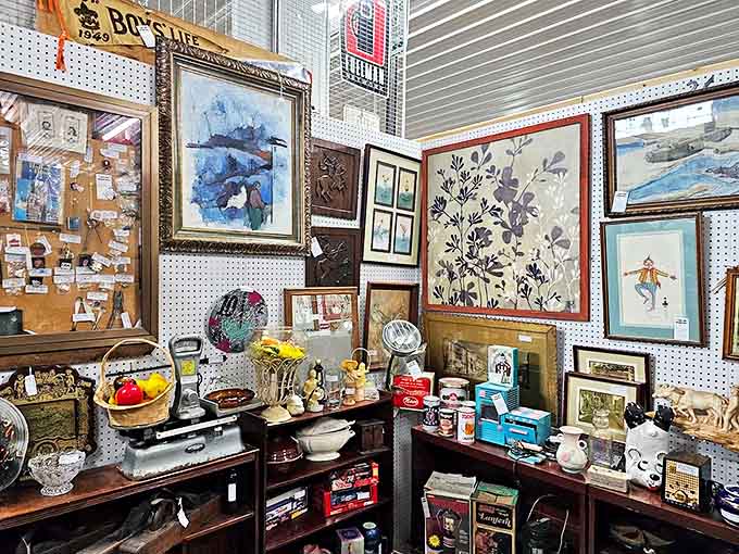 Every frame tells a story in this art-filled booth, where vintage paintings and curios create a museum-worthy display of everyday treasures.