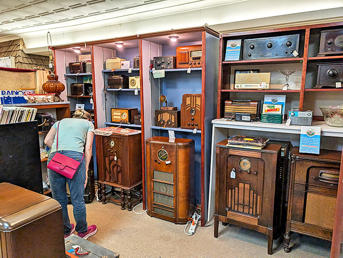 The radio collection showcases technology's evolution from furniture-worthy centerpieces to disposable gadgets – each dial and knob representing family gatherings around evening broadcasts.